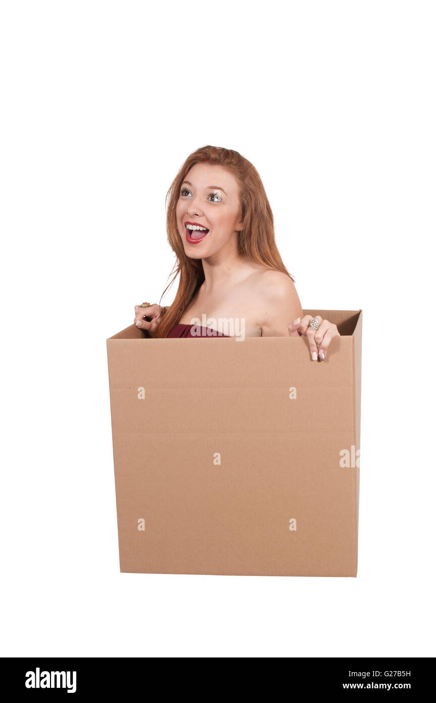 Beautiful woman thinking outside of the box Stock Photo - Alamy