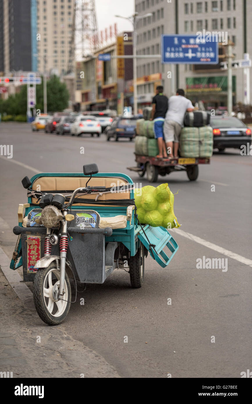 Motorized cart bikes are frequently used for delivering freight on the ...