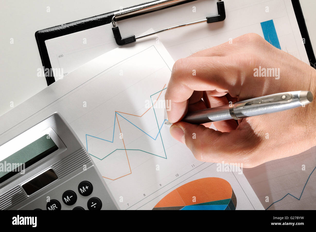 analyzing a person to chart on paper Stock Photo - Alamy