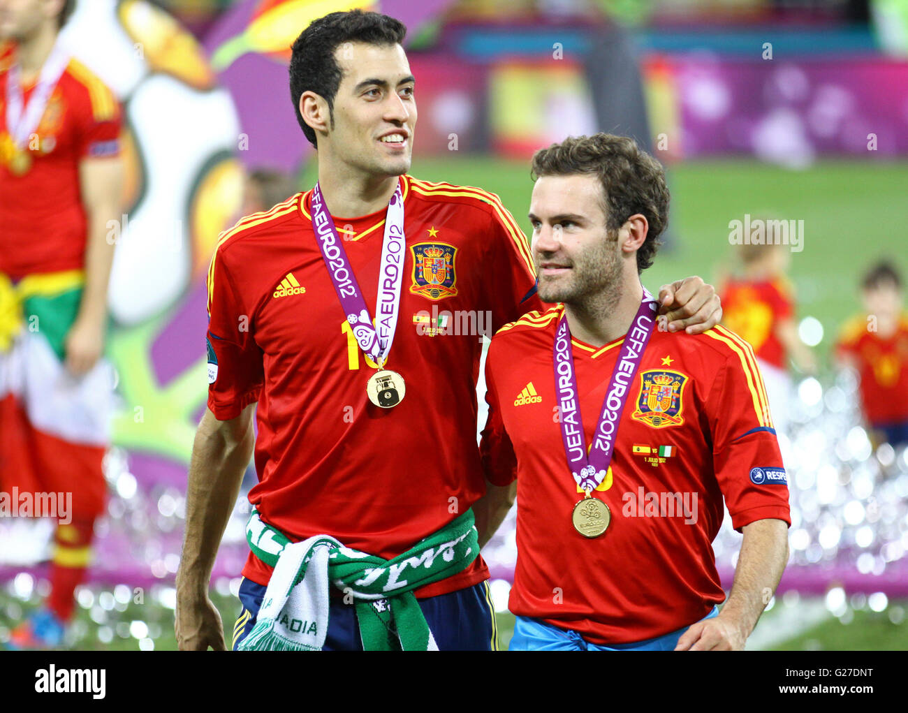 Sergio Busquets and Juan Mata of Spain walk on after UEFA EURO 2012 ...