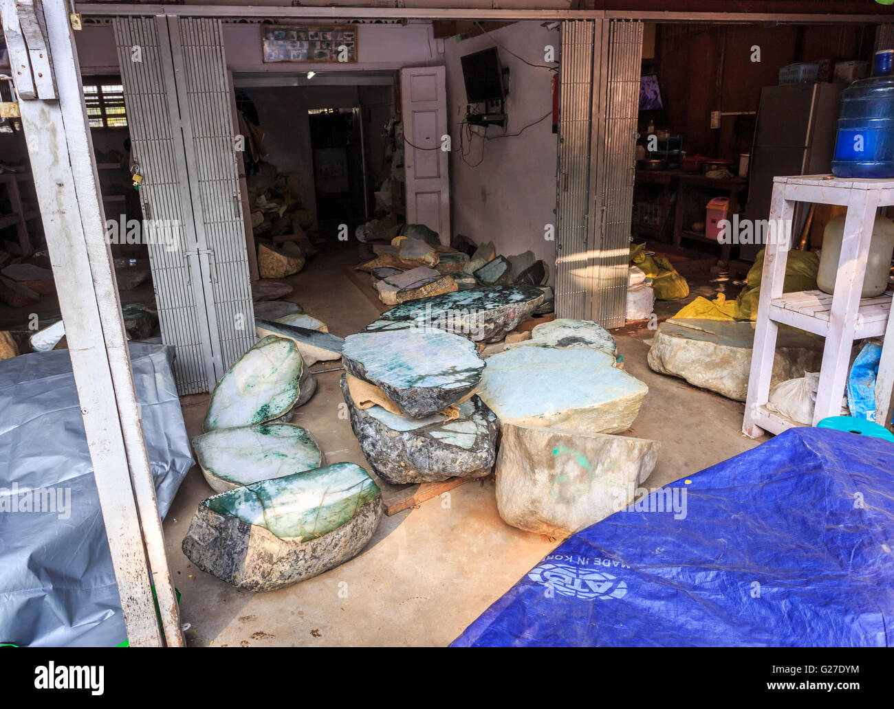 Large pieces of rough cut jade in storage in the Jade Market, Mandalay ...