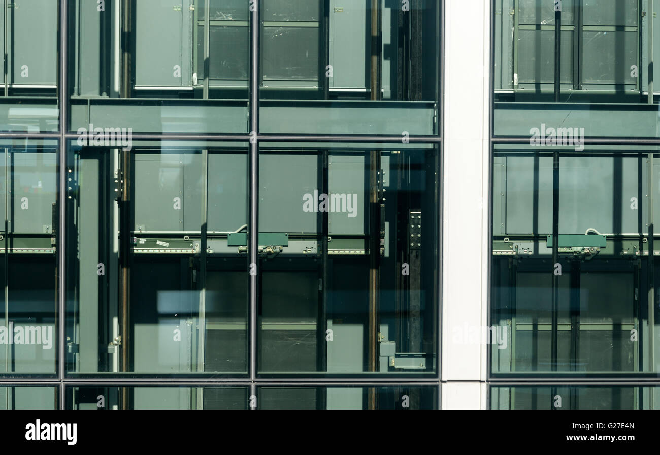 Industrial abstract window with mechanical fittings viewed from near ...