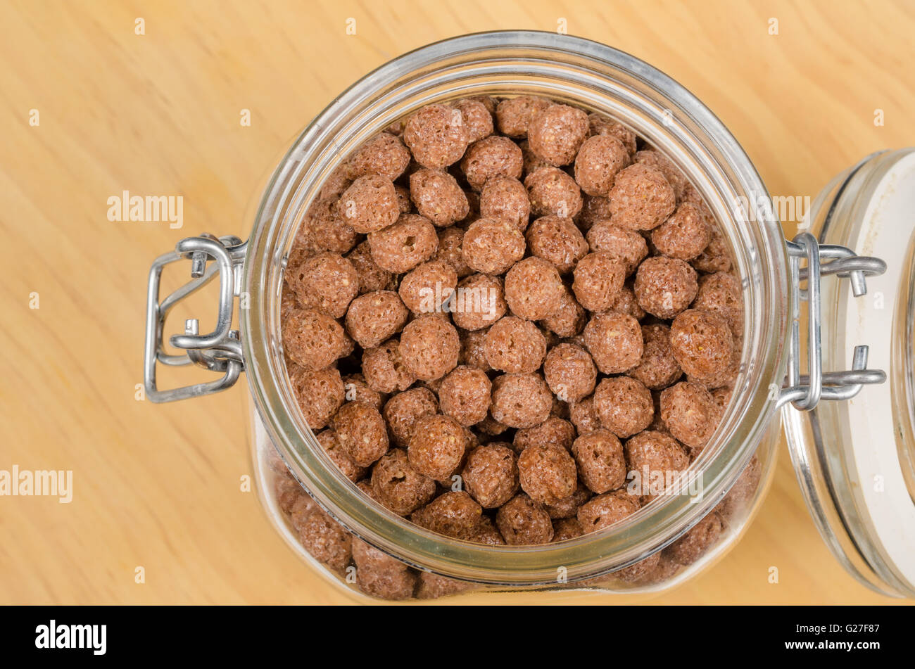 Chocolate flavored cereal balls in a glass jar Stock Photo - Alamy
