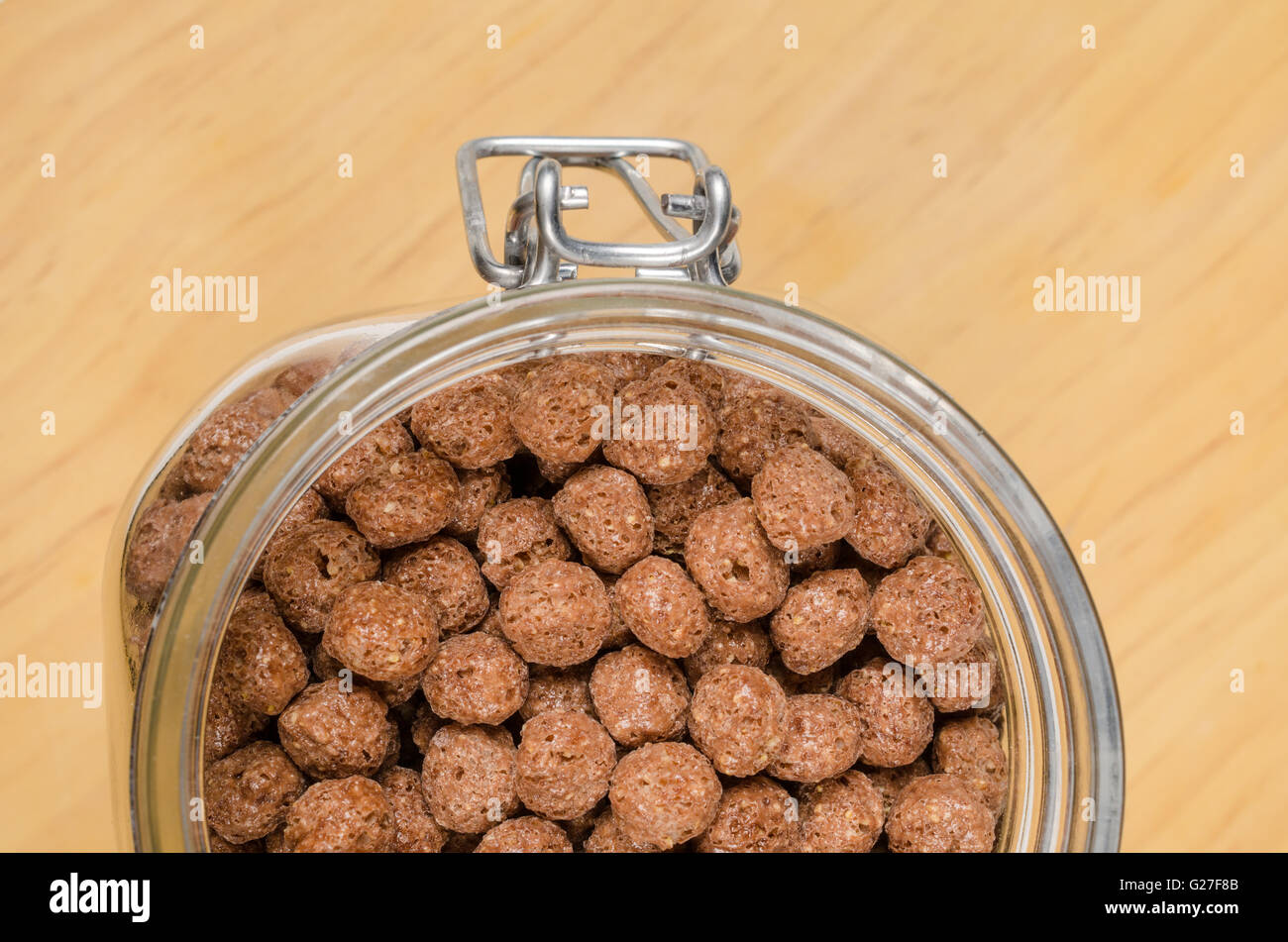 Chocolate flavored cereal balls in a glass jar Stock Photo - Alamy