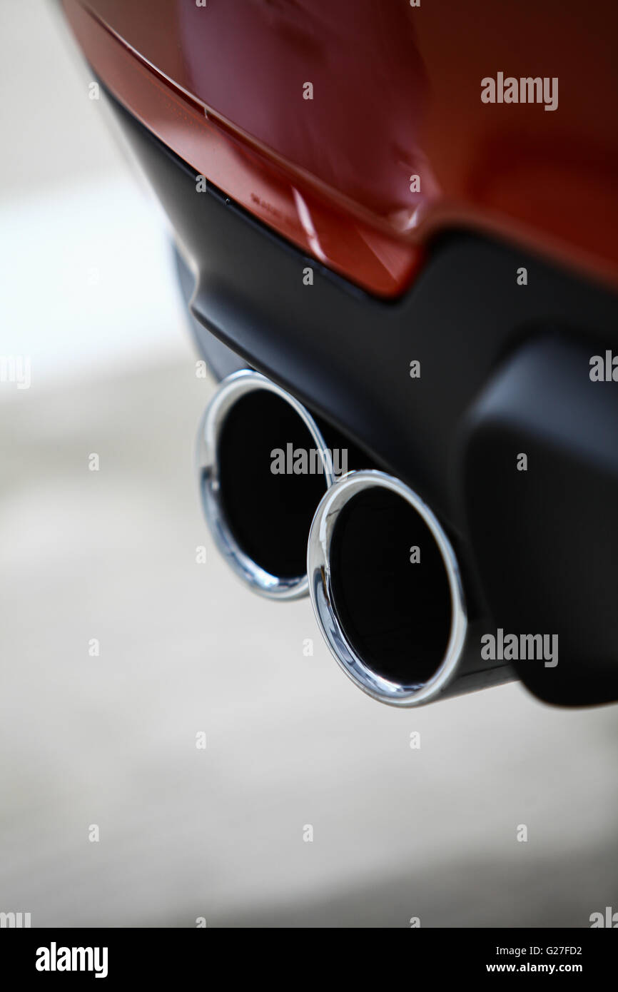 Detail of the double exhaust of a car Stock Photo - Alamy