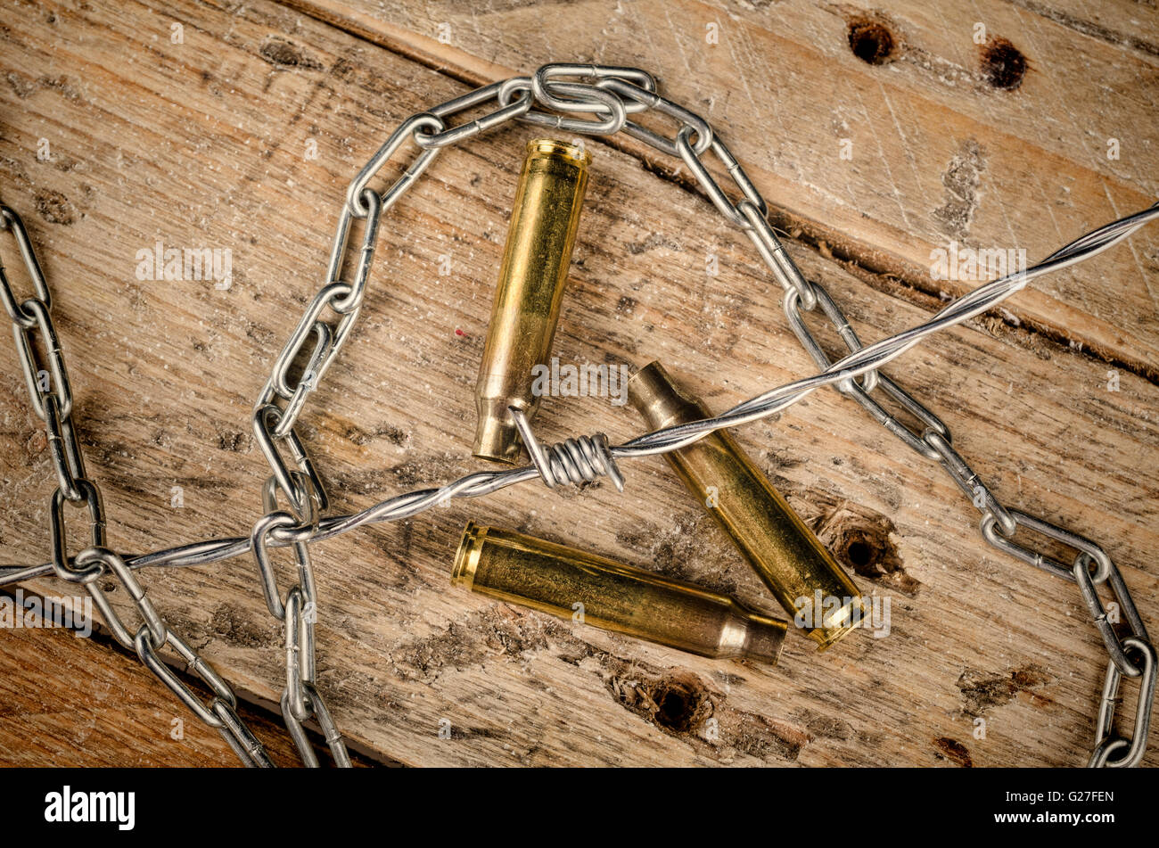 Bullet shells and barbed wire, a concept Stock Photo - Alamy