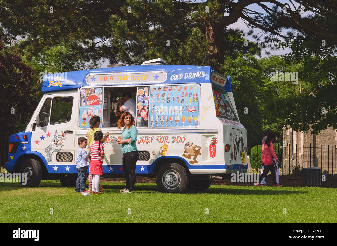 Ice Cream vintage van waiting for customer in fun fair Stock Photo - Alamy