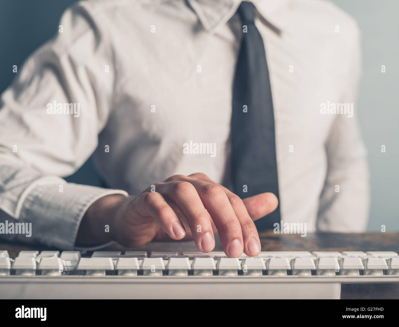 Young black man typing computer hi-res stock photography and images - Alamy