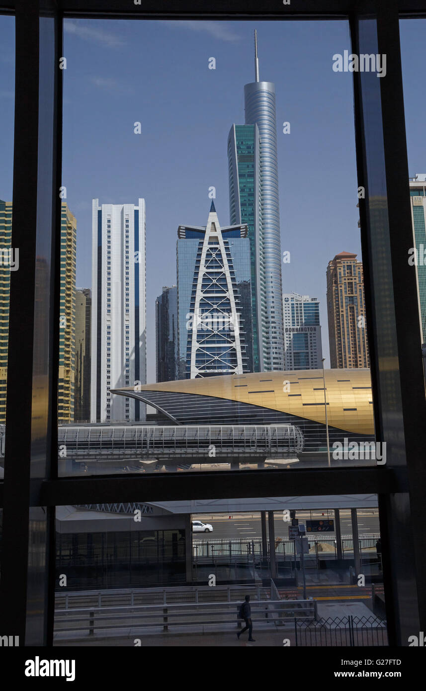 view through window on skyscrapers and metro station in Dubai Stock ...