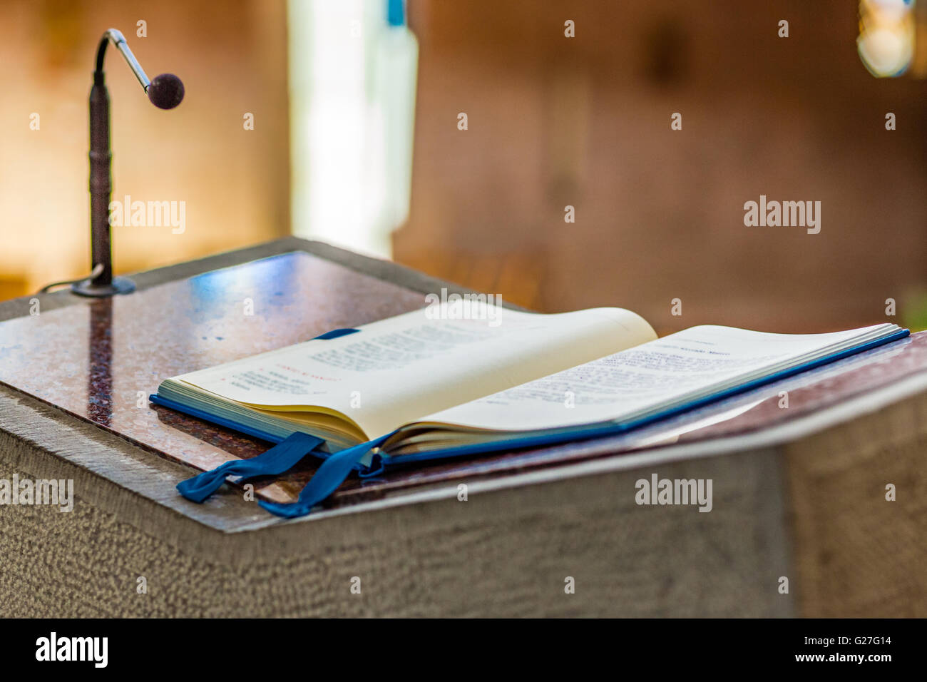 Gospel book open on the concrete pulpit to be read Stock Photo - Alamy