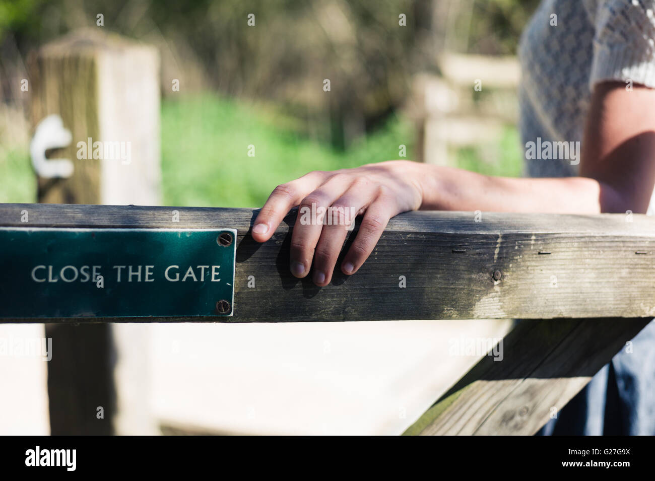 Woman opening gate hi-res stock photography and images - Alamy