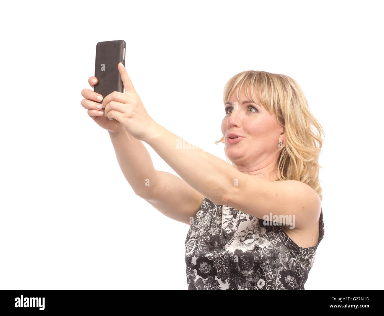 Beautiful woman taking self picture with smartphone camera. Isolated on ...