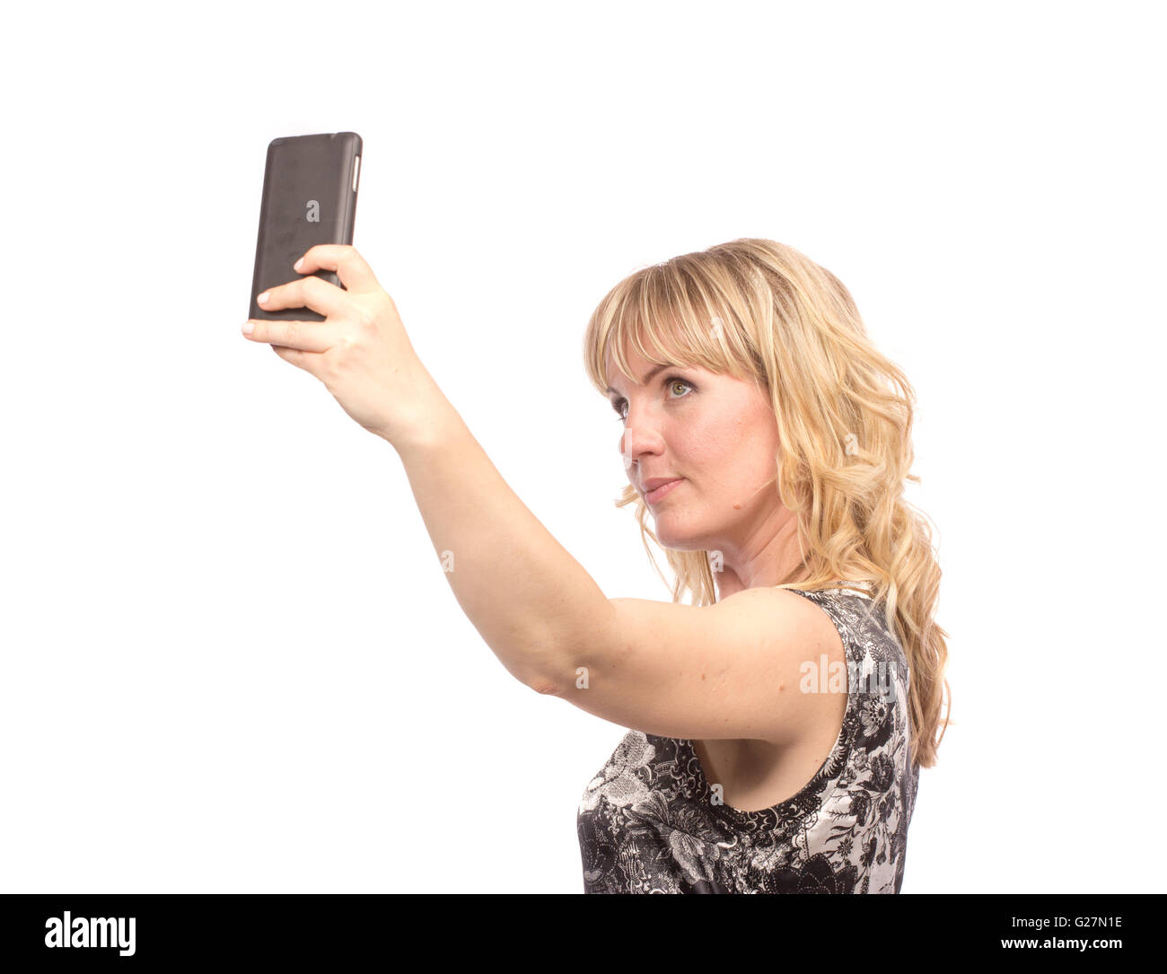 Beautiful woman taking self picture with smartphone camera. Isolated on ...