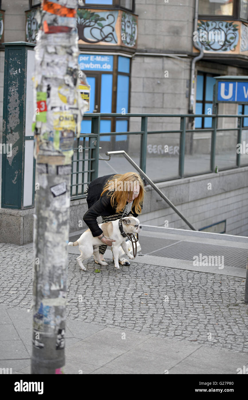German actress Andrea Sawatzki carries her dog Hugo to ...