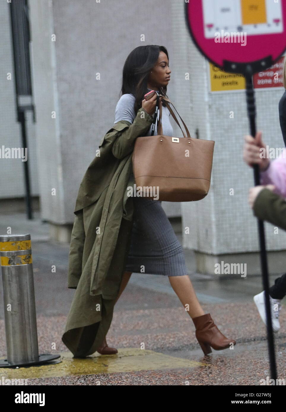 Staff leave the ITV studios following a fire drill on Monday afternoon ...