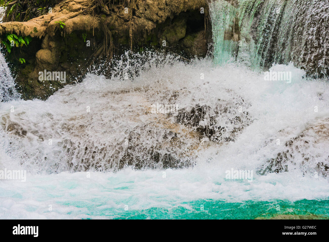Splashing water of a waterfall, Tat Kuang Si waterfalls, Luang Prabang ...