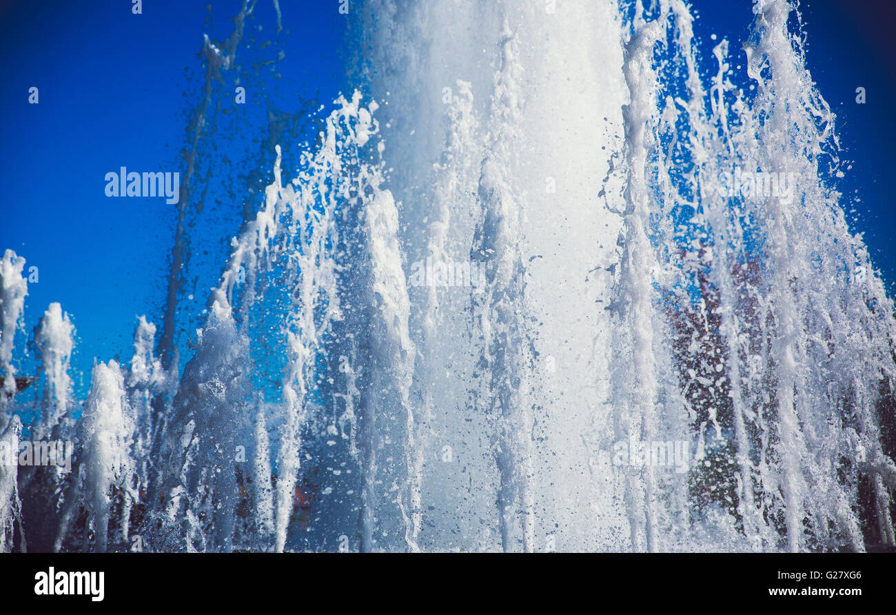 Dancing high water fountains in bright sunlight Stock Photo - Alamy