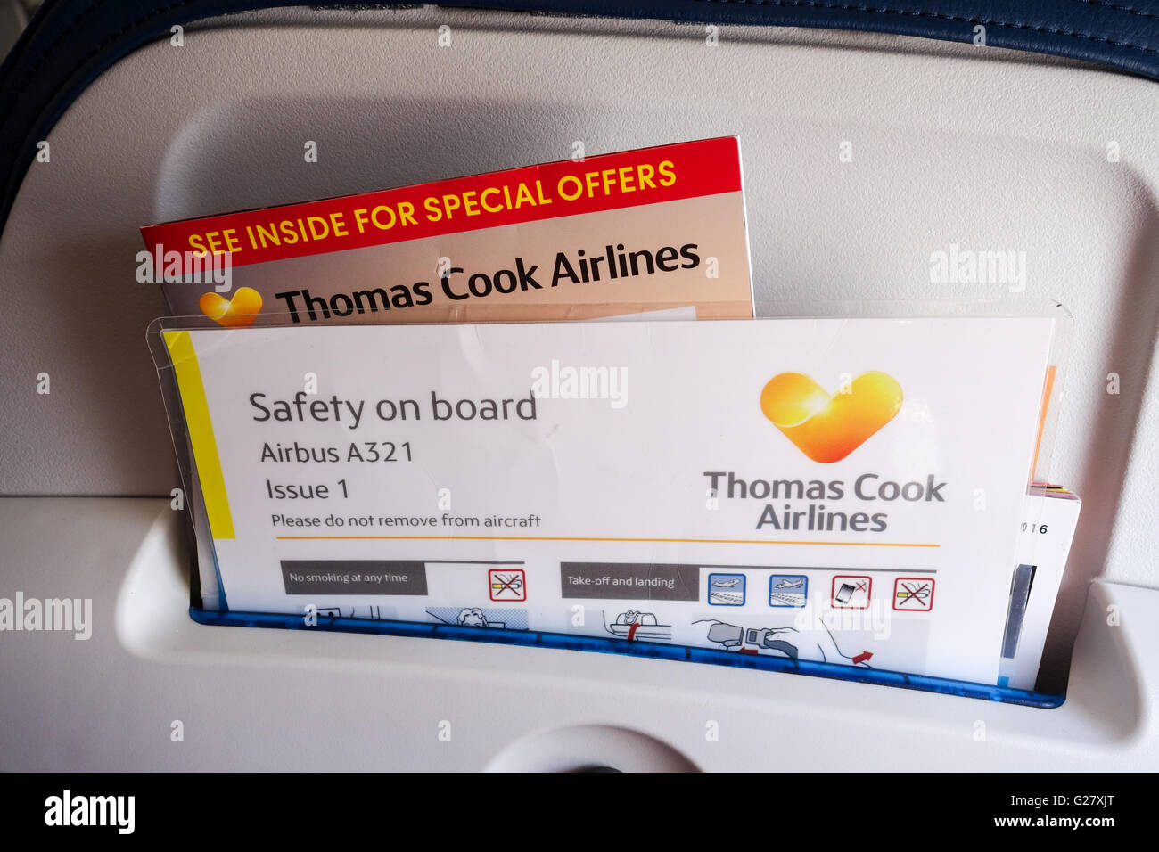 Safety instructions in the back of a seat on a Thomas Cook airlines ...