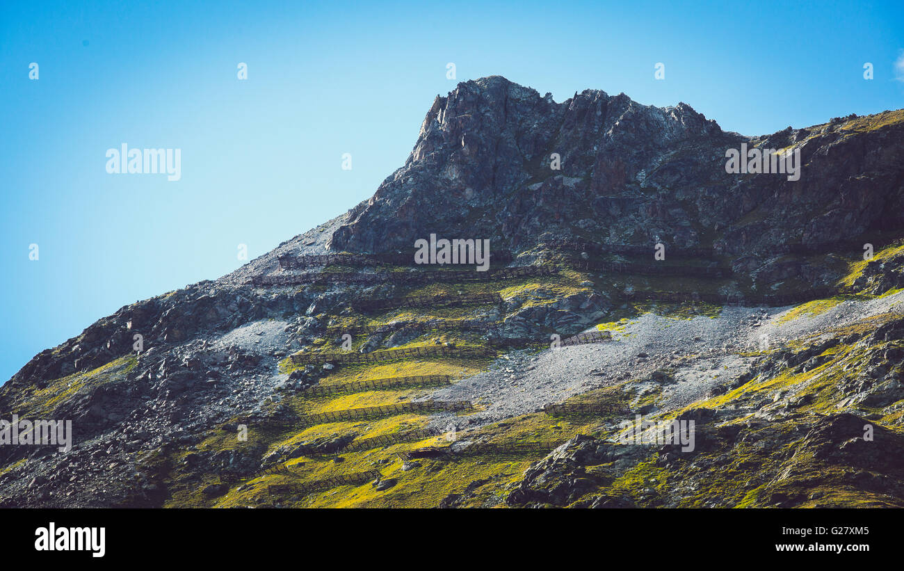 Avalanche barriers at summer in the mountains Stock Photo - Alamy