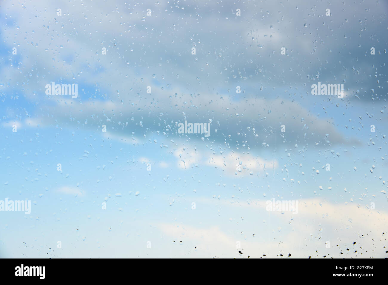 Raindrops on a window.Through the glass sky and clouds Stock Photo - Alamy