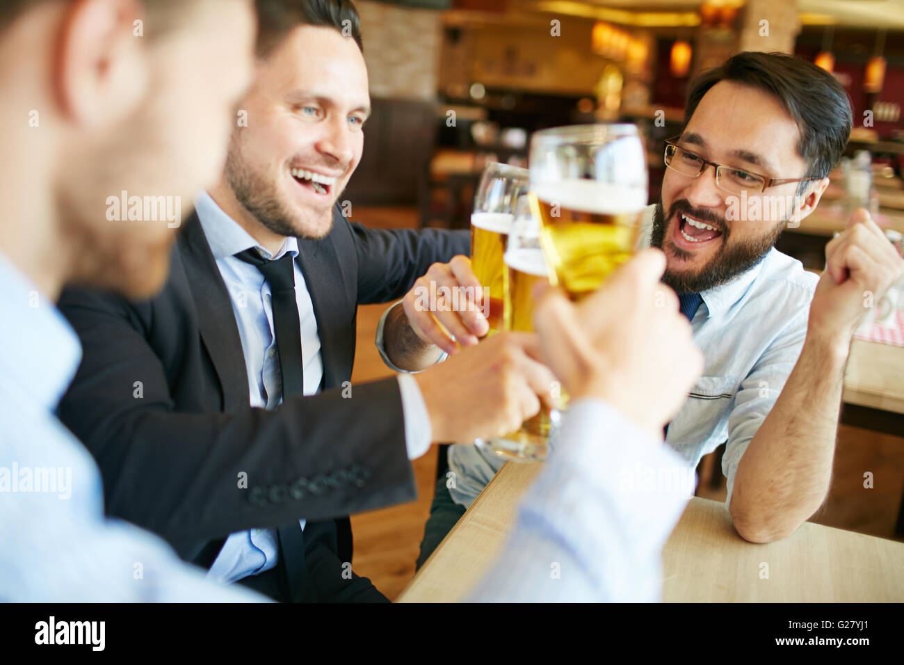 Young smiling businessman toasting hi-res stock photography and images ...
