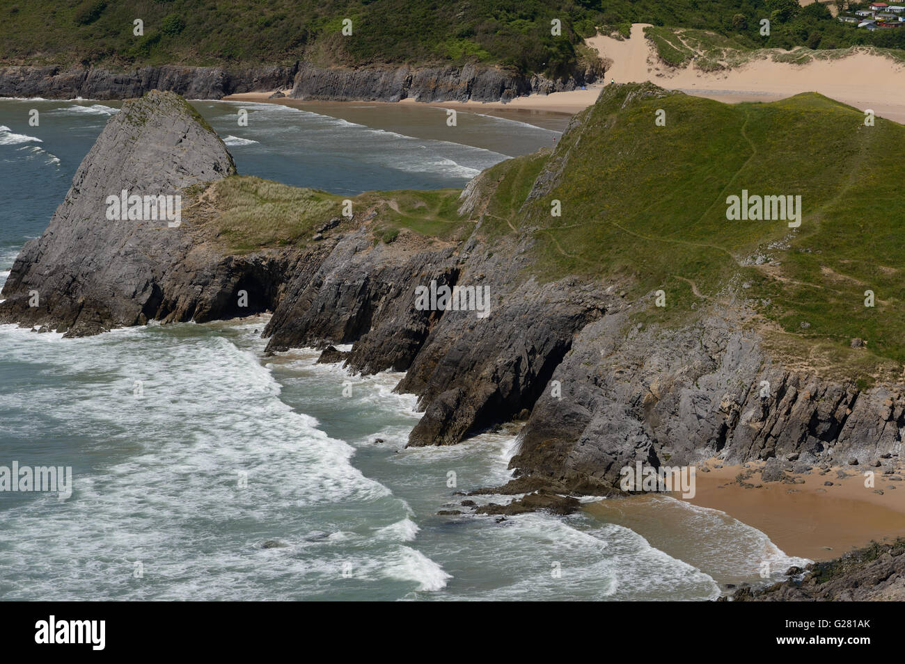 Looking down on the surf and cliffs of two Gower beaches,Wales, UK ...