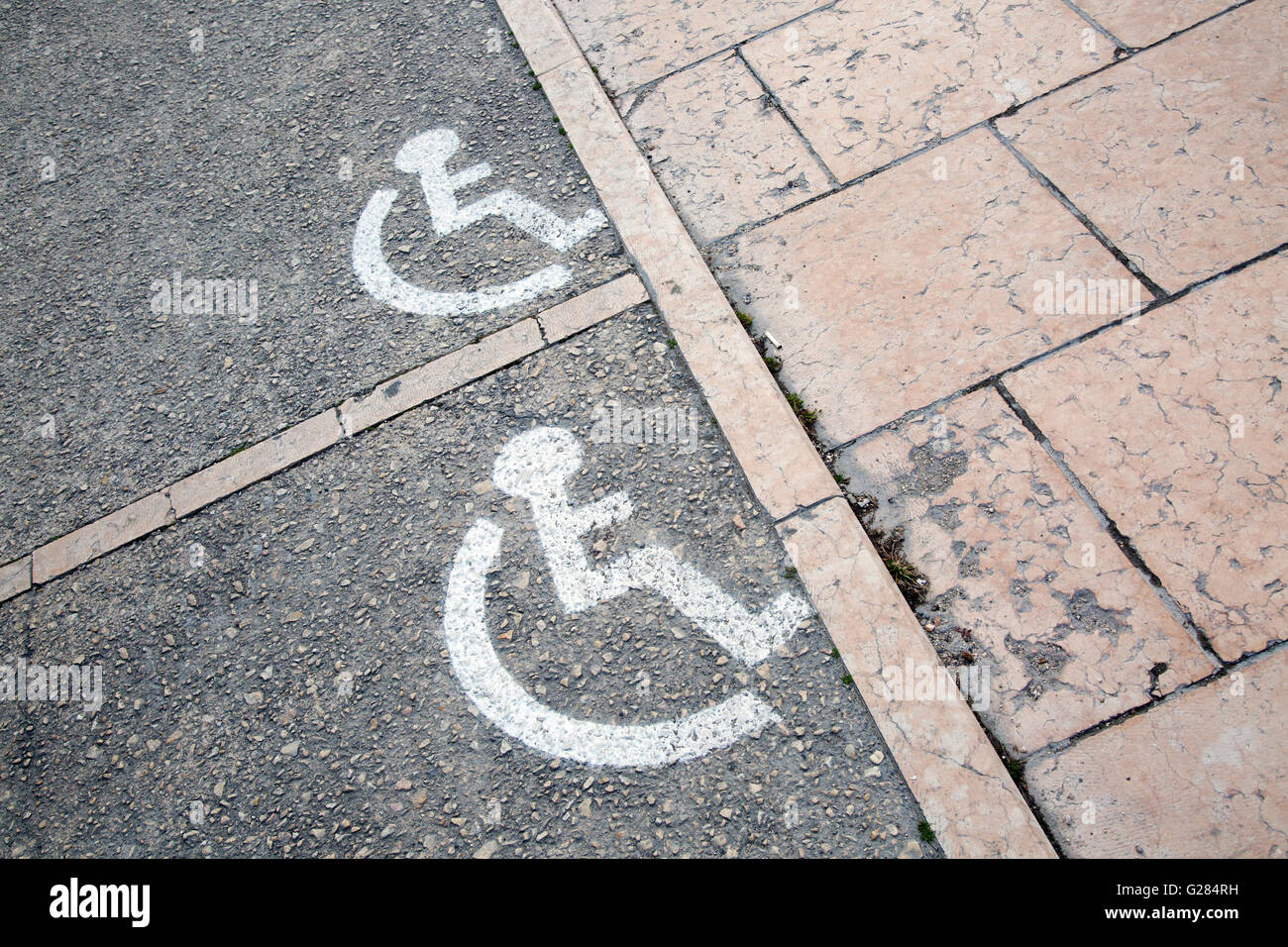Disabled Parking Sign on Street Surface Stock Photo - Alamy