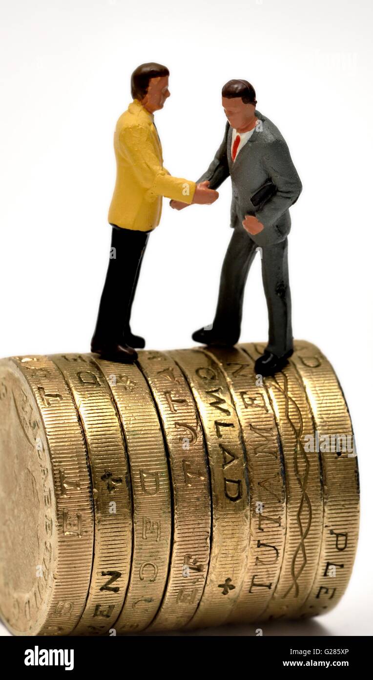 Handshake pound coins hi-res stock photography and images - Alamy