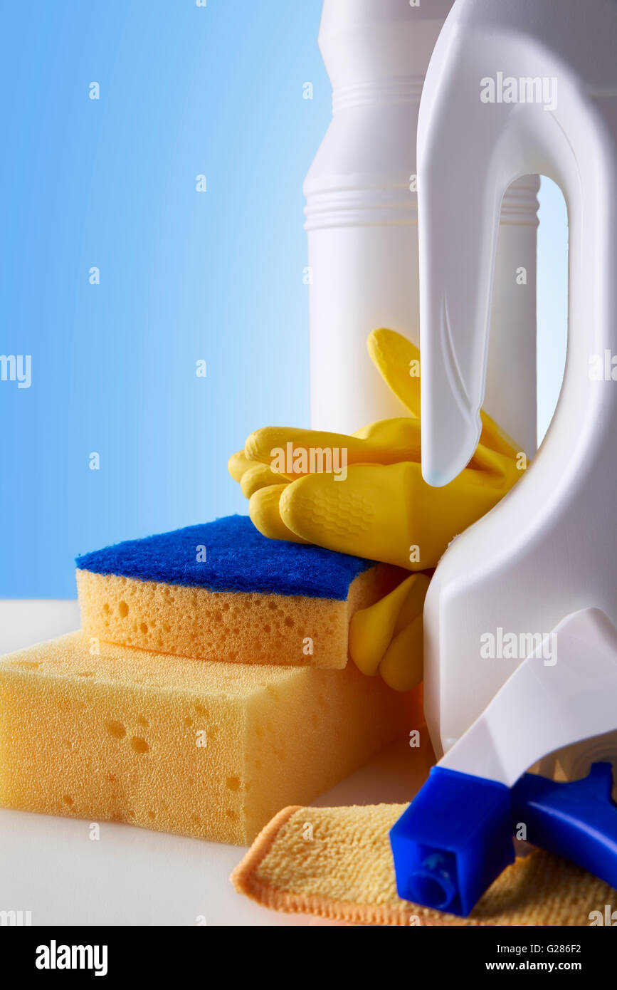 Professional cleaning equipment on white table and blue background ...