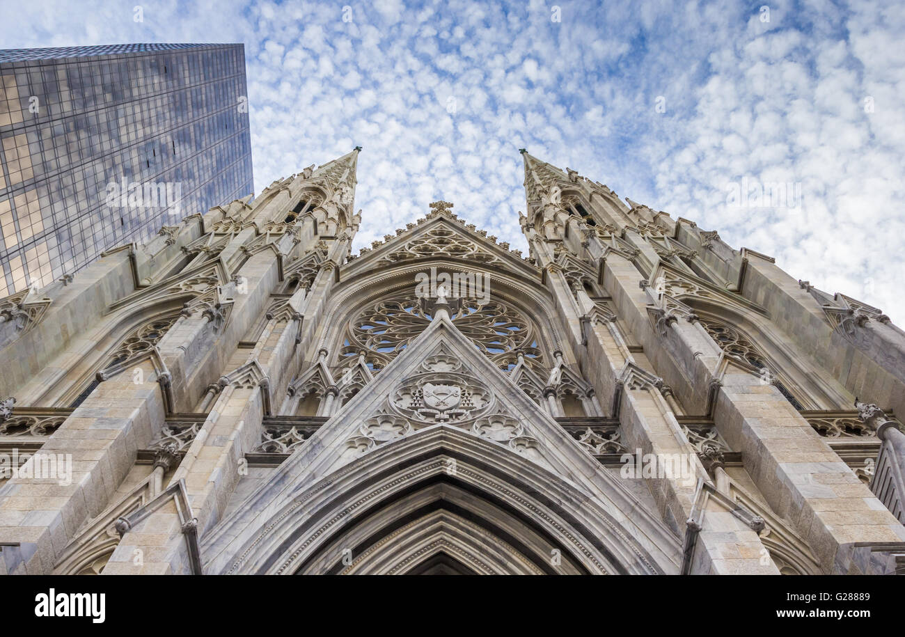 Front of St. Patricks Cathedral and a skyscraper in New York City, USA ...