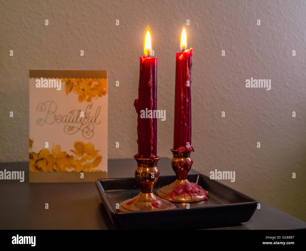 Lit red tapers, greeting card, neutral background Stock Photo - Alamy