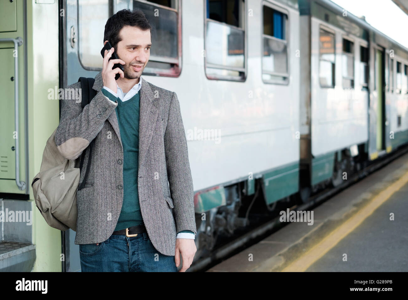 Person with a phone at the train station hi-res stock photography and ...