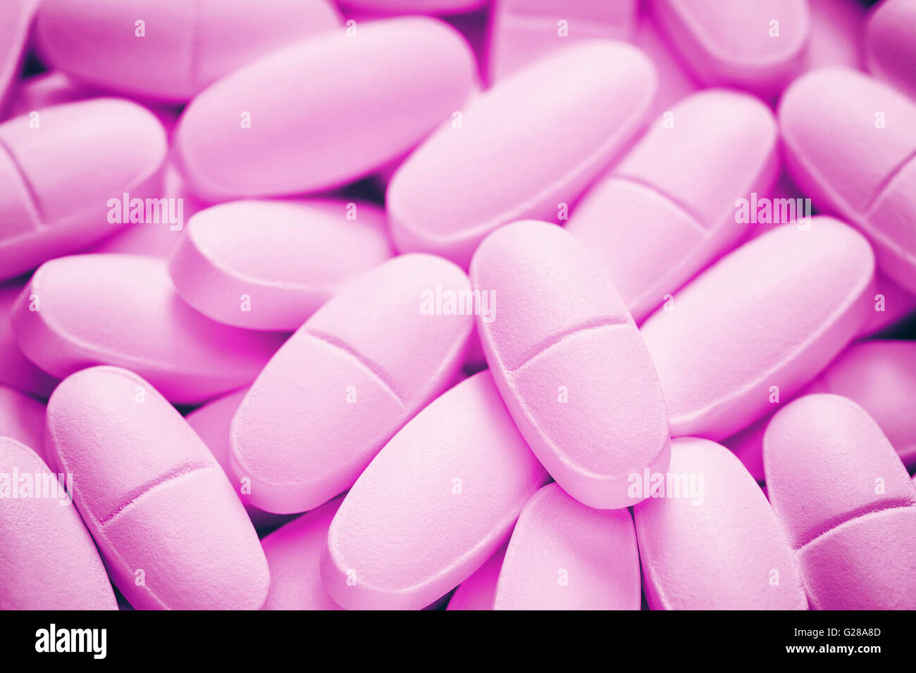 Pile of pink pills. Close up Stock Photo - Alamy