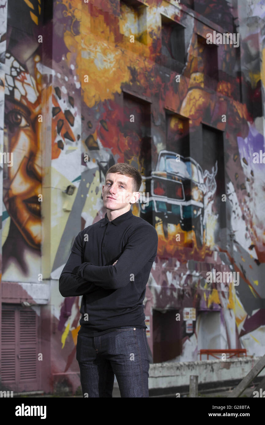 EDITORIAL USE ONLY Louis Berry, with a giant piece of street art in ...