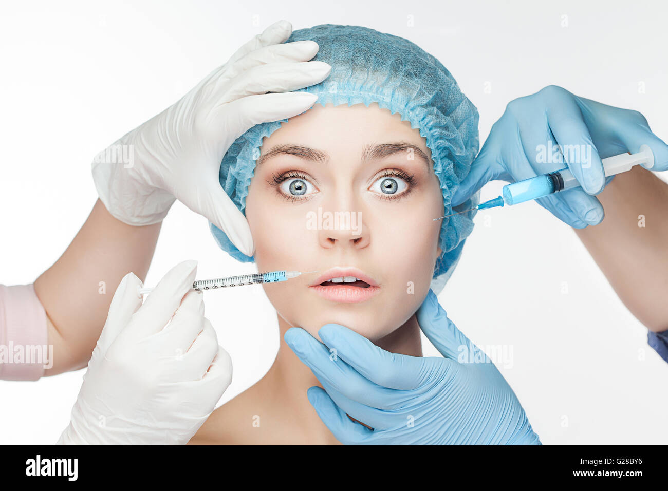 Attractive woman at plastic surgery with syringe in her face Stock ...