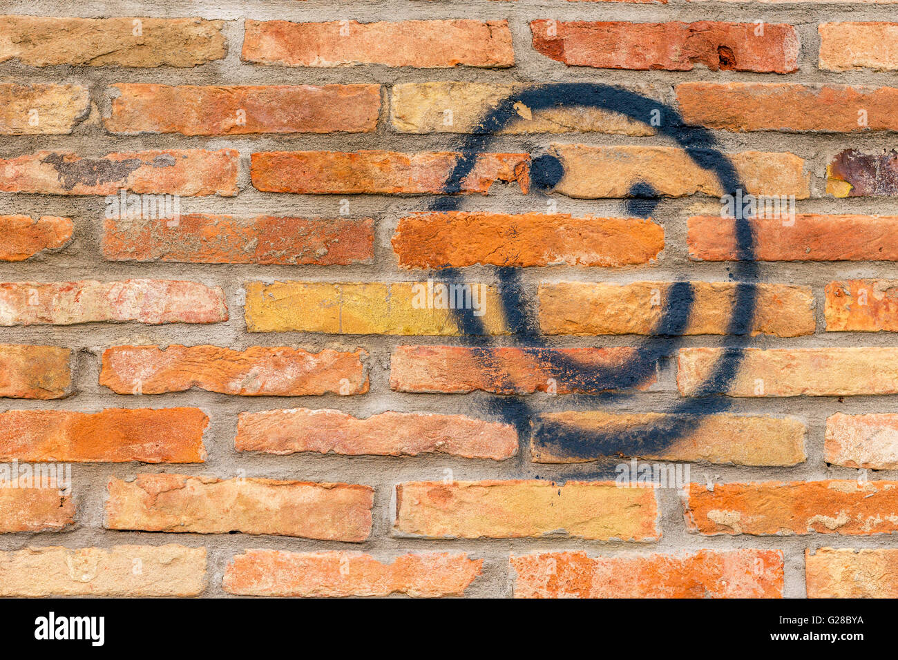 smiley face drawn on a brick wall Stock Photo - Alamy