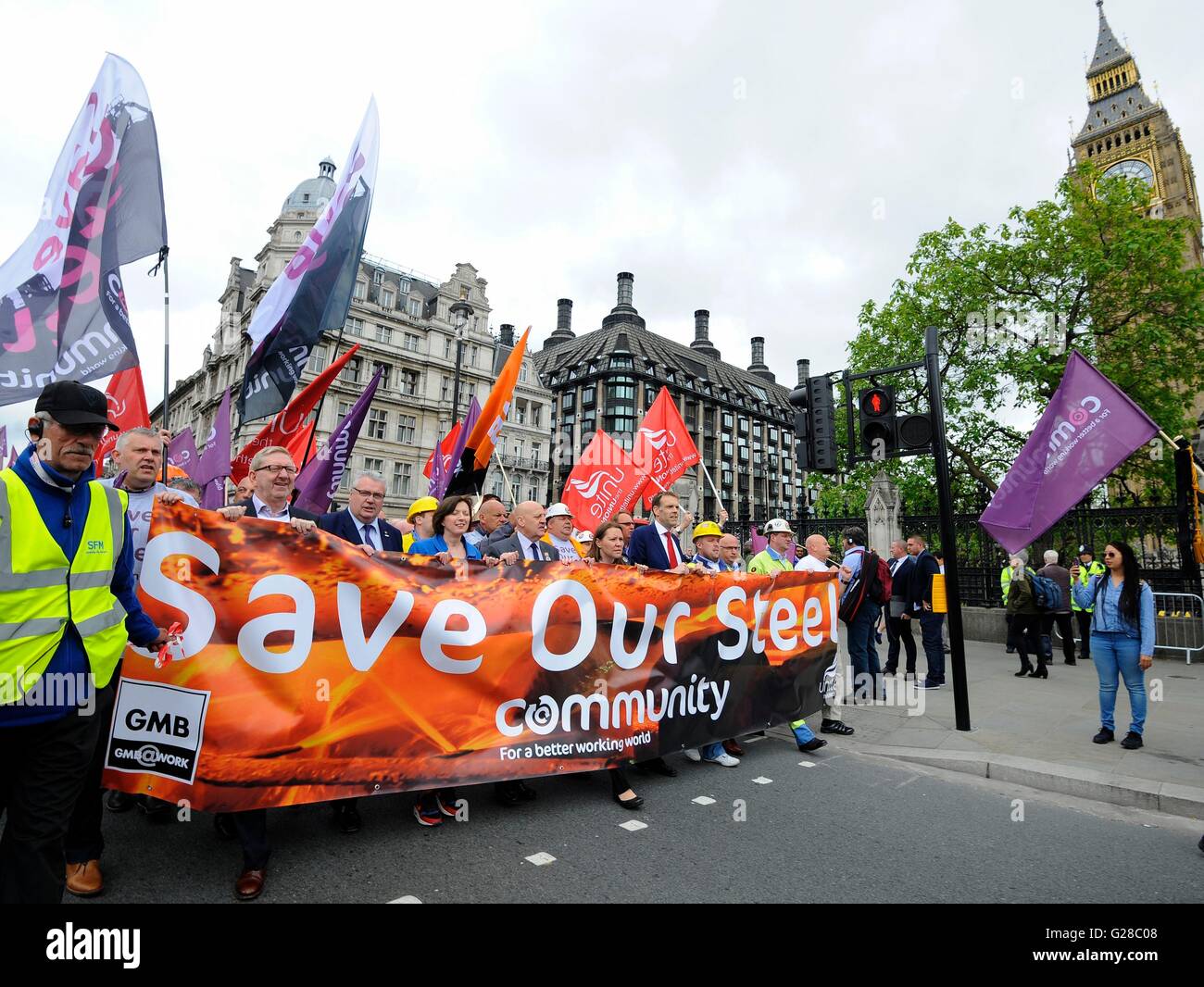 Steelworkers from across the UK march past Parliament in central London ...