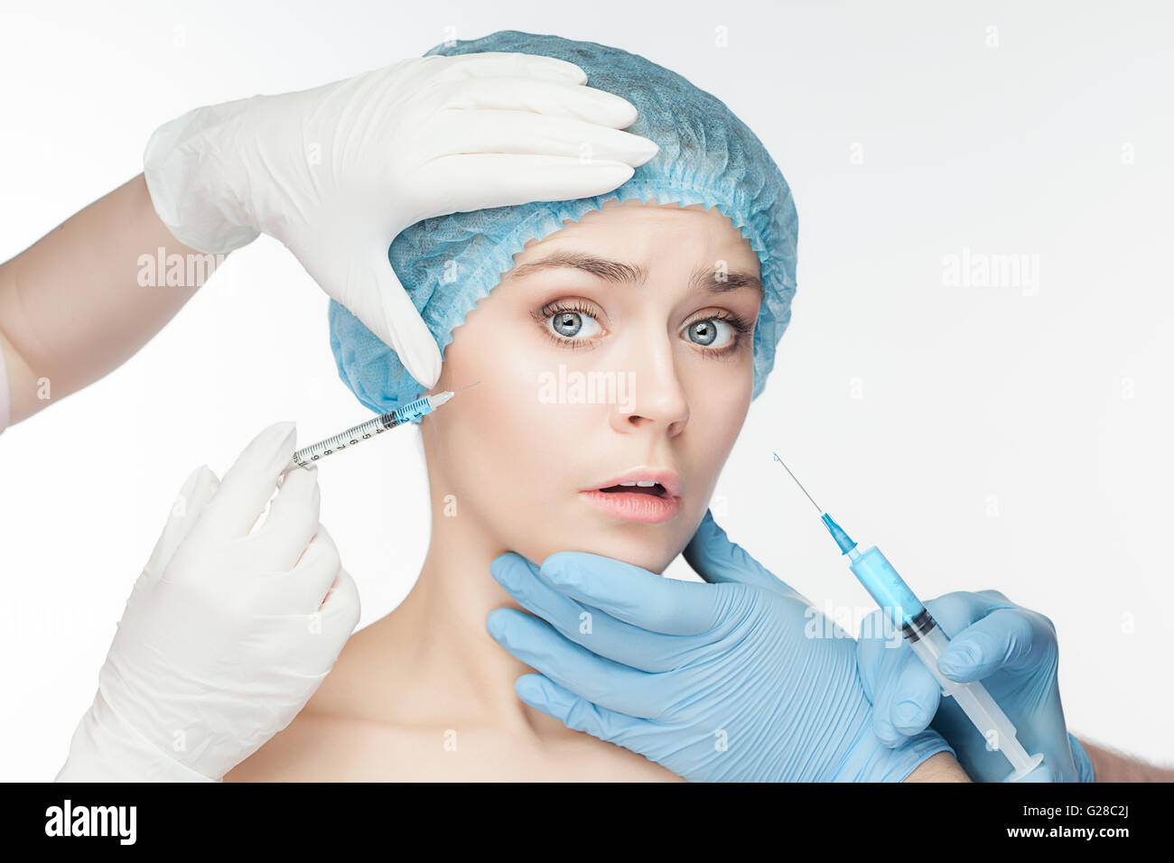 Attractive woman at plastic surgery with syringe in her face Stock ...