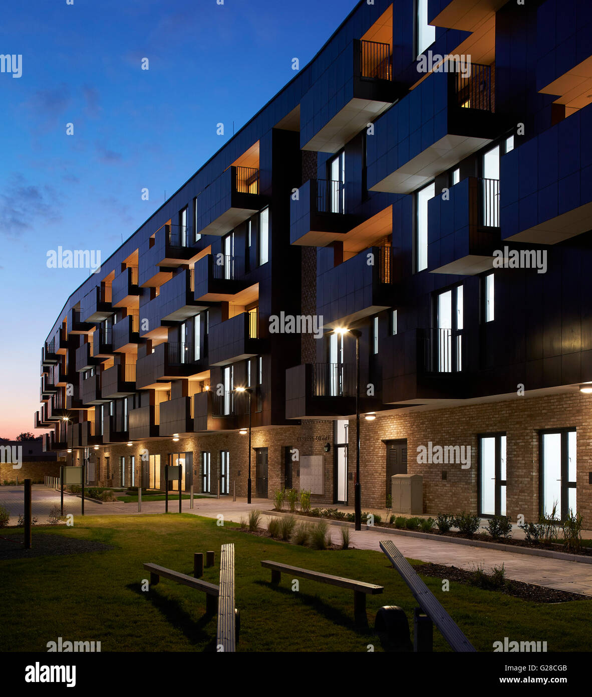 Facade perspective with protruding balconies at dusk. Alpine Place ...