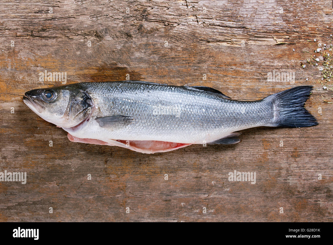 Raw seebass fish Stock Photo - Alamy