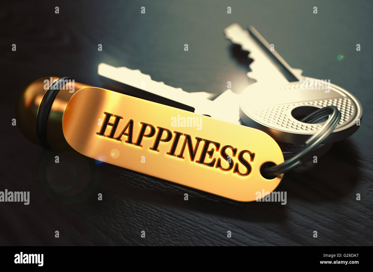 Happiness. Concept on Golden Keychain Stock Photo - Alamy