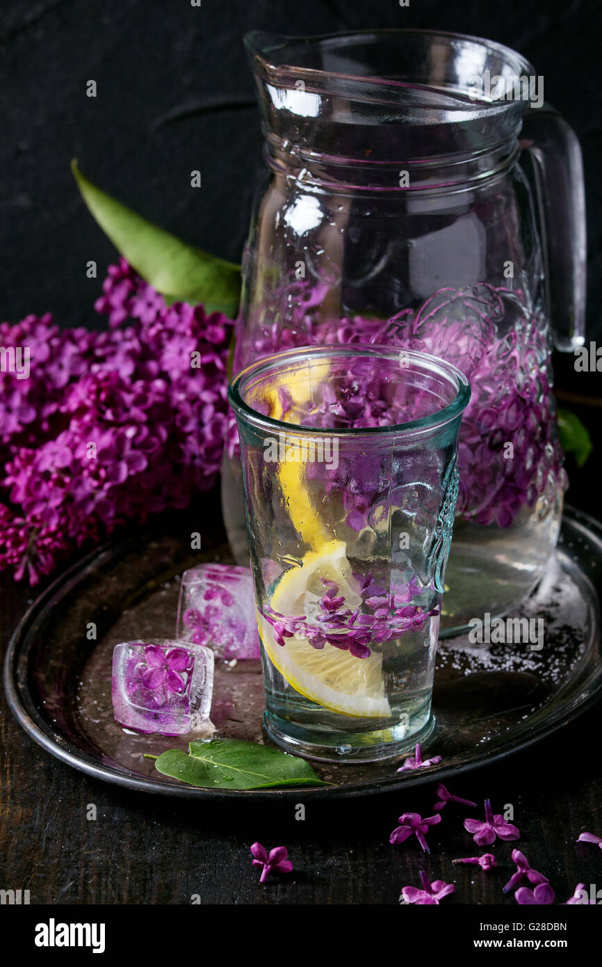 Lilac water with lemon Stock Photo - Alamy