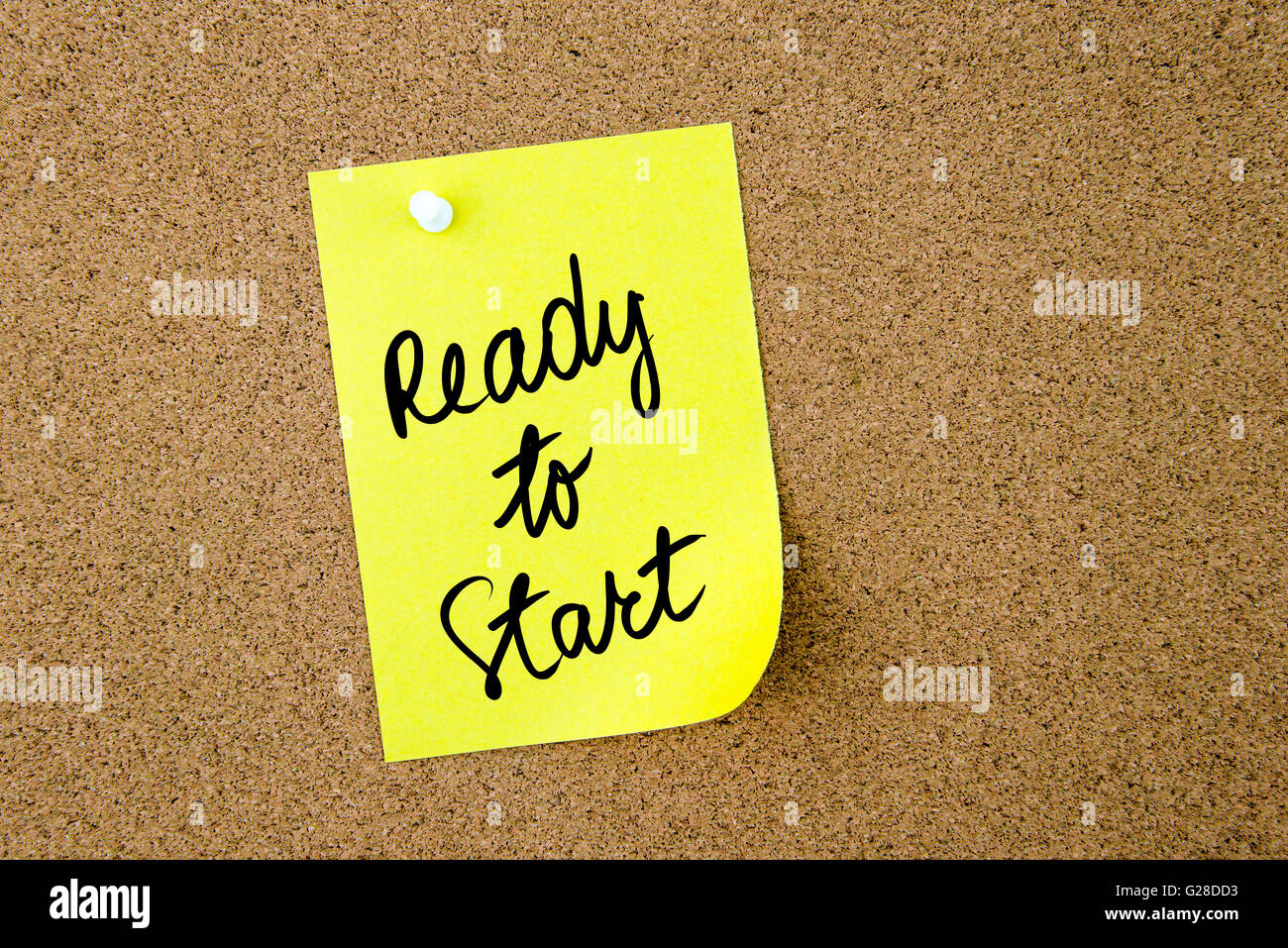 Ready To Start written on yellow paper note pinned on cork board with ...
