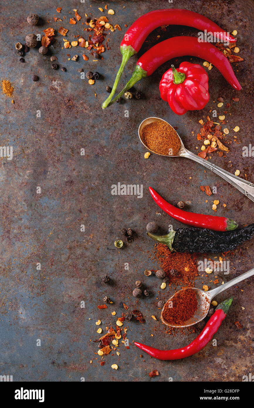 Spicy background with chili peppers Stock Photo - Alamy