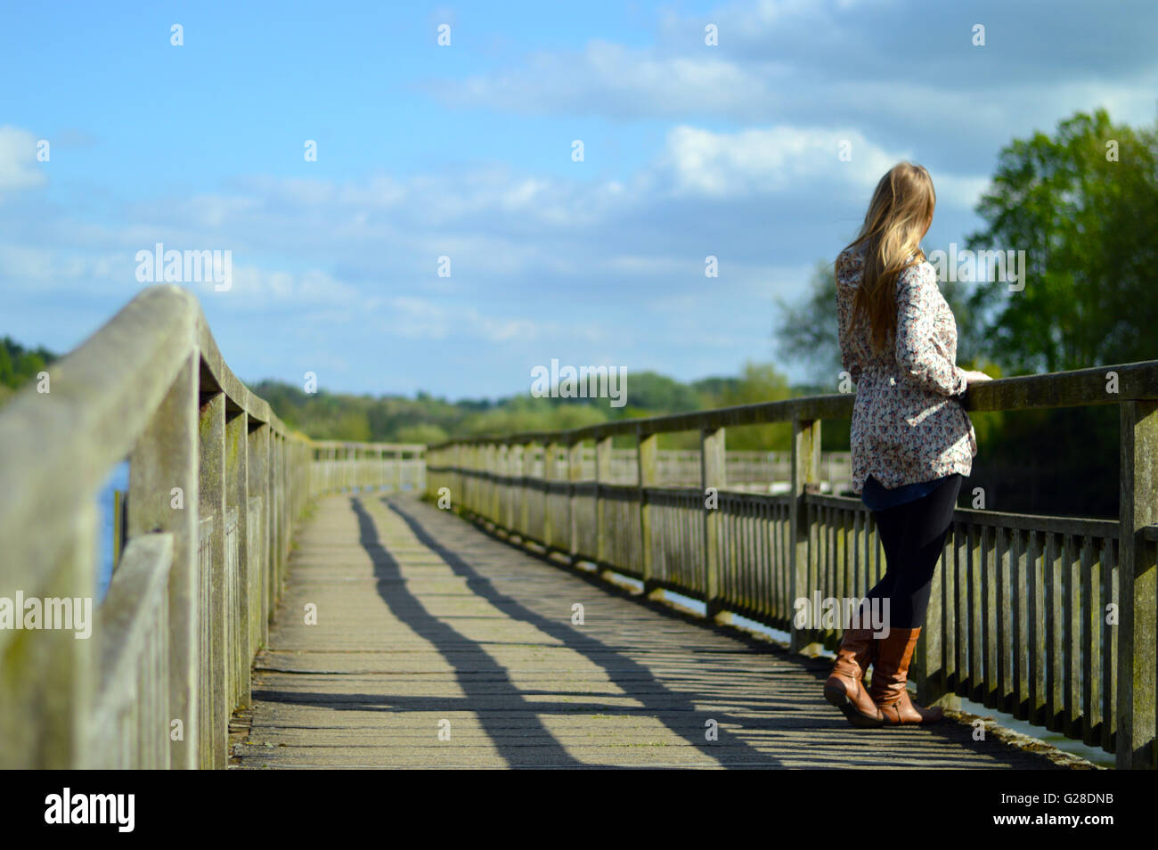Woman girl walking bridge river hi-res stock photography and images - Alamy