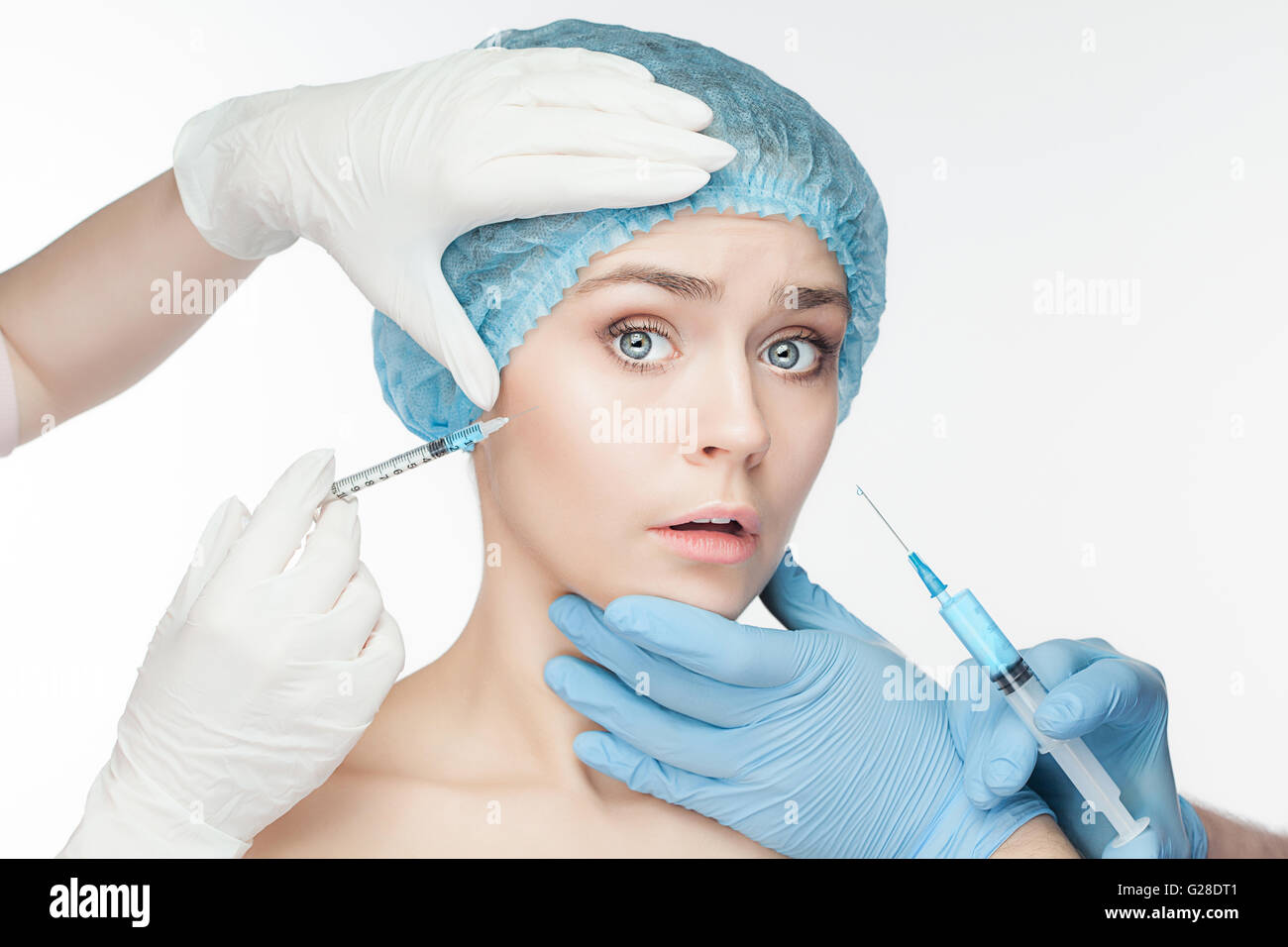Attractive woman at plastic surgery with syringe in her face Stock ...