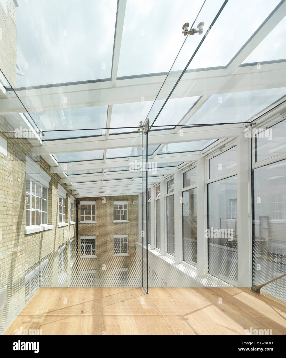 Glazed box cantilevering into atrium. Heal's, Torrington Place, London ...