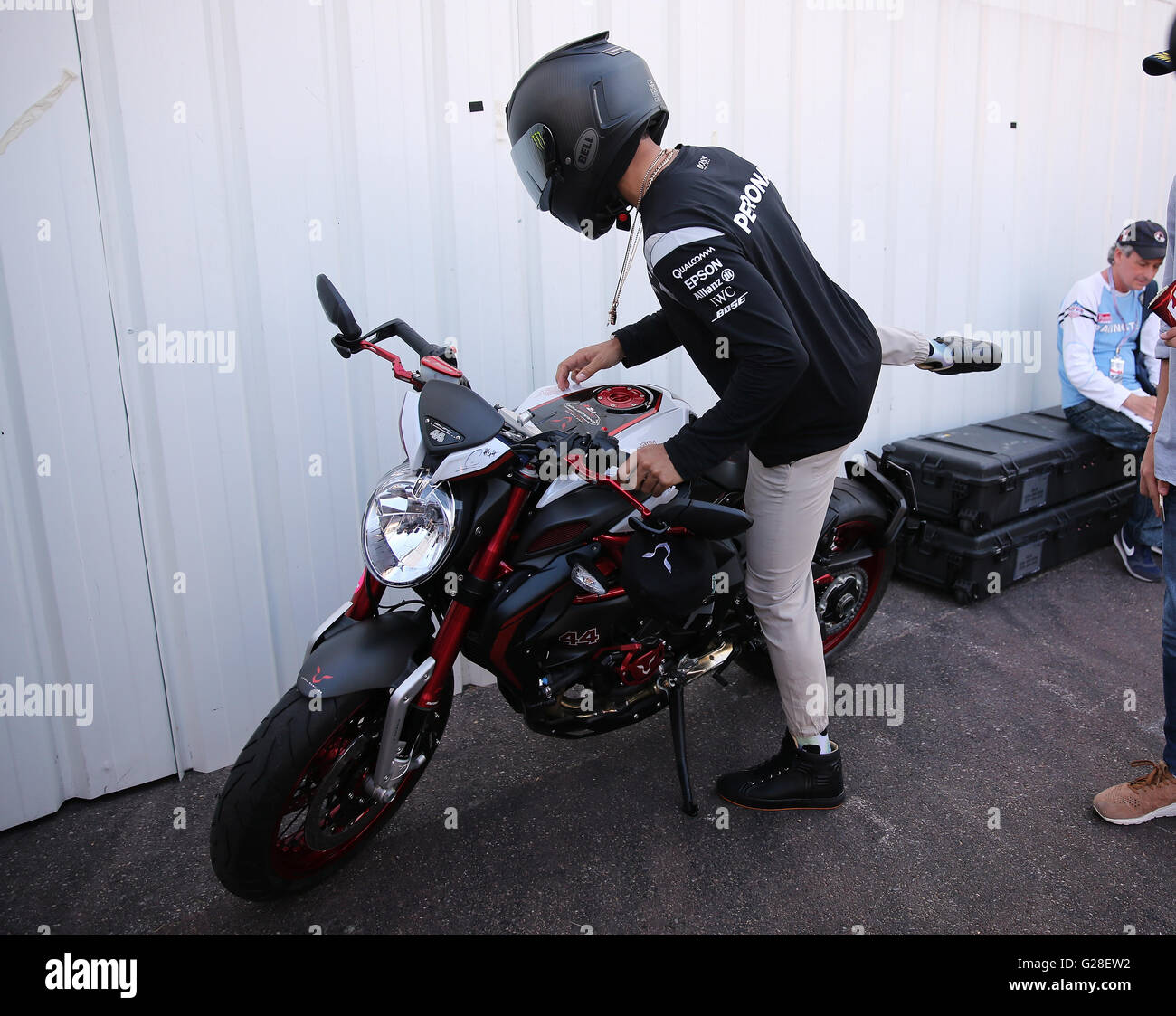 Mercedes driver Lewis Hamilton leaves the pitlane on his bike at the ...