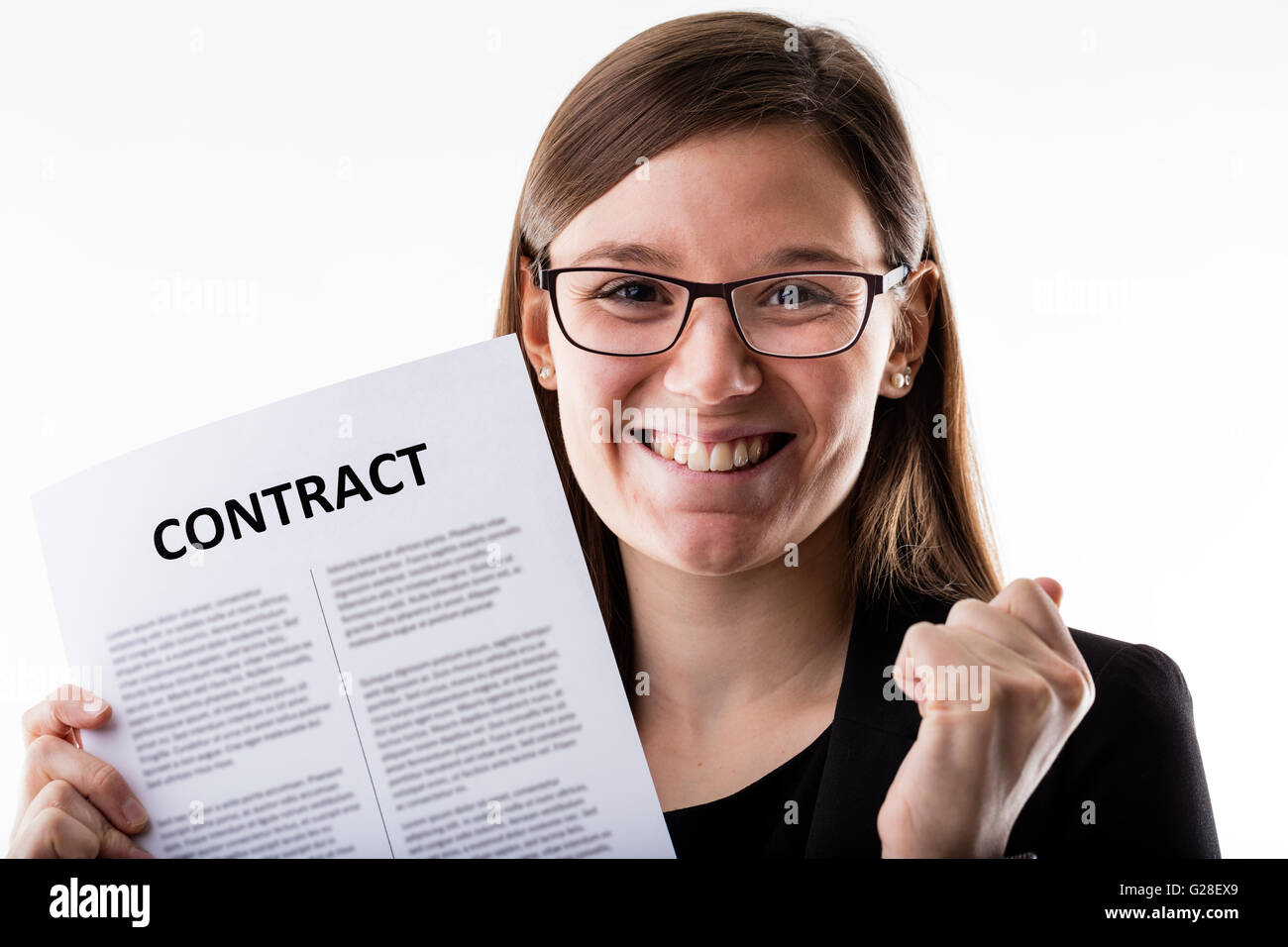 smiling woman holding a contract and exulting because she's good at her ...
