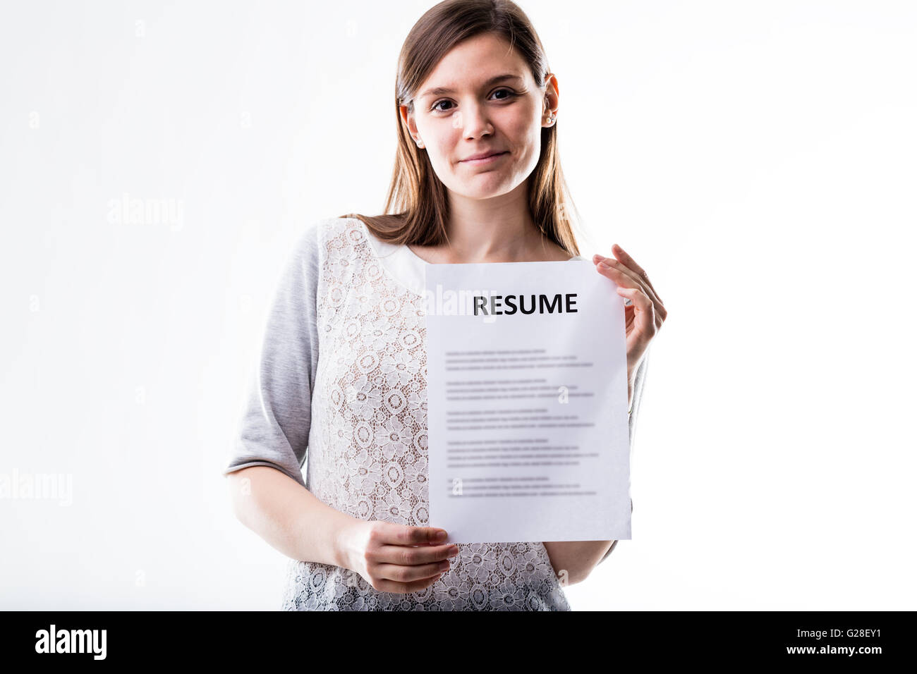 happy woman holding a resume on a white background Stock Photo - Alamy